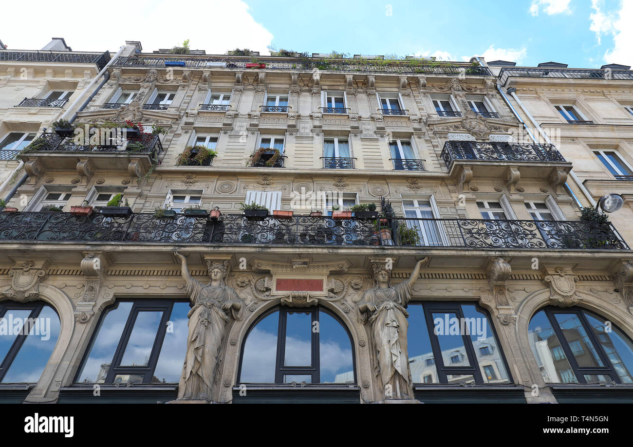 Traditional French house with typical balconies and windows. Paris ...