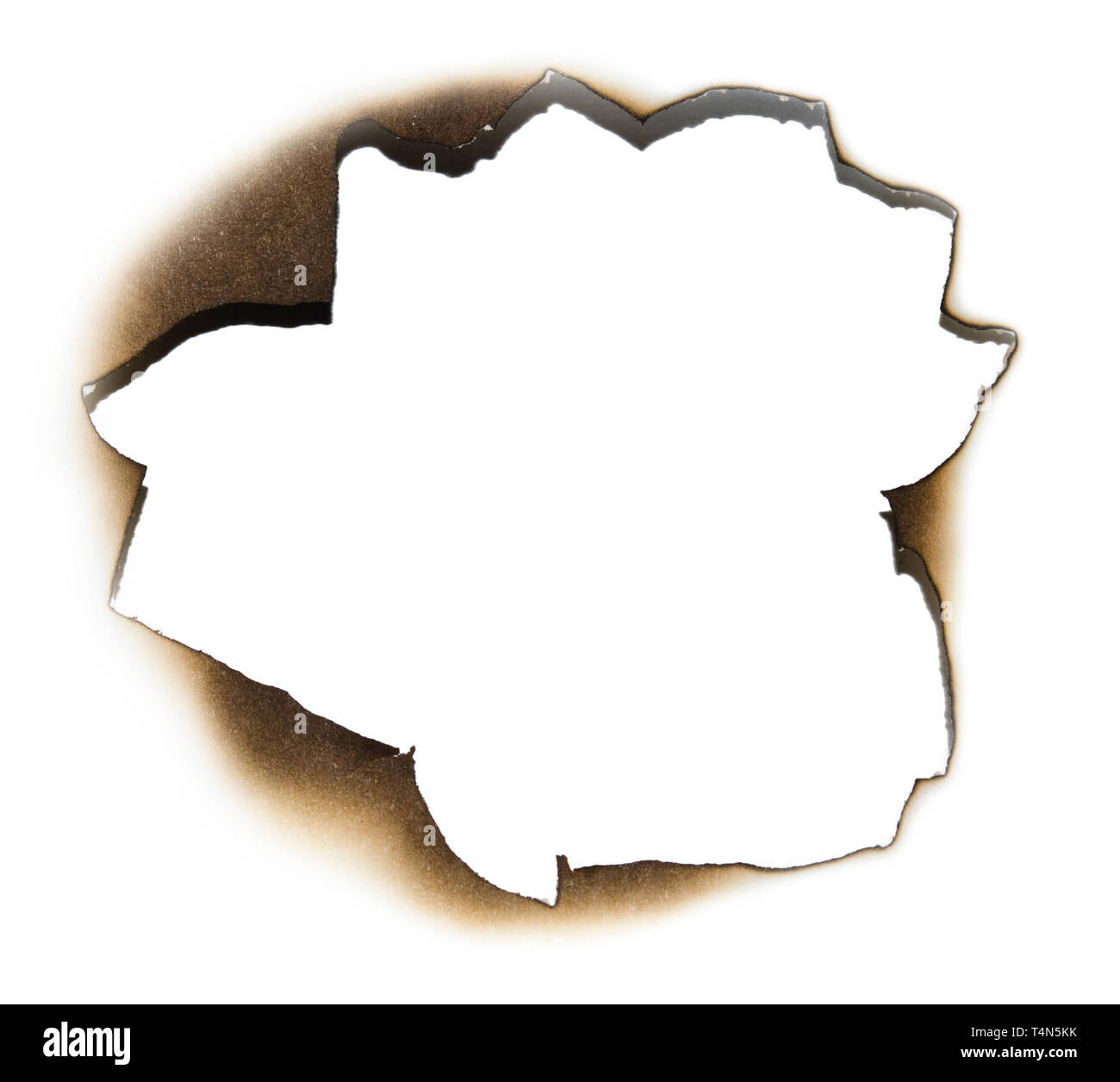Burnt hole in a piece of paper isolated on white background Stock Photo ...