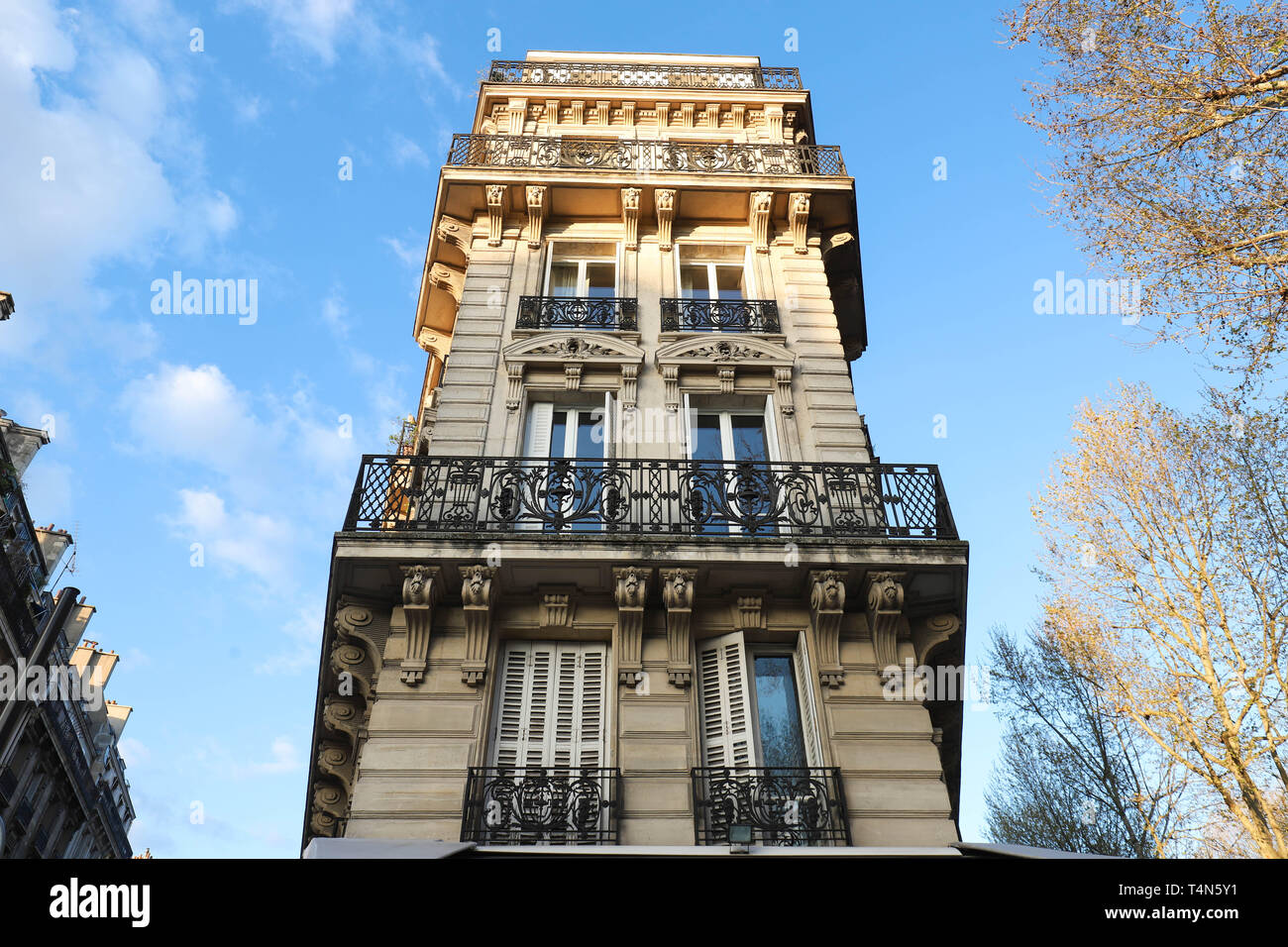 Traditional French house with typical balconies and windows. Paris ...
