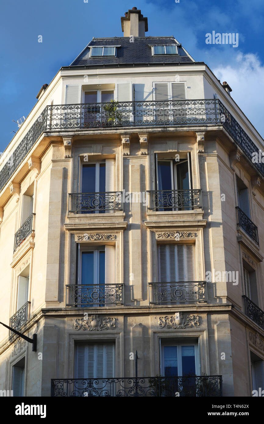 Traditional French house with typical balconies and windows. Paris ...