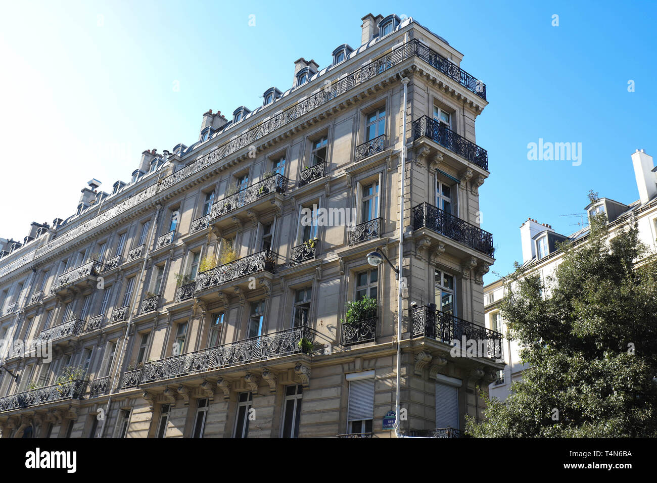 Traditional French house with typical balconies and windows. Paris ...