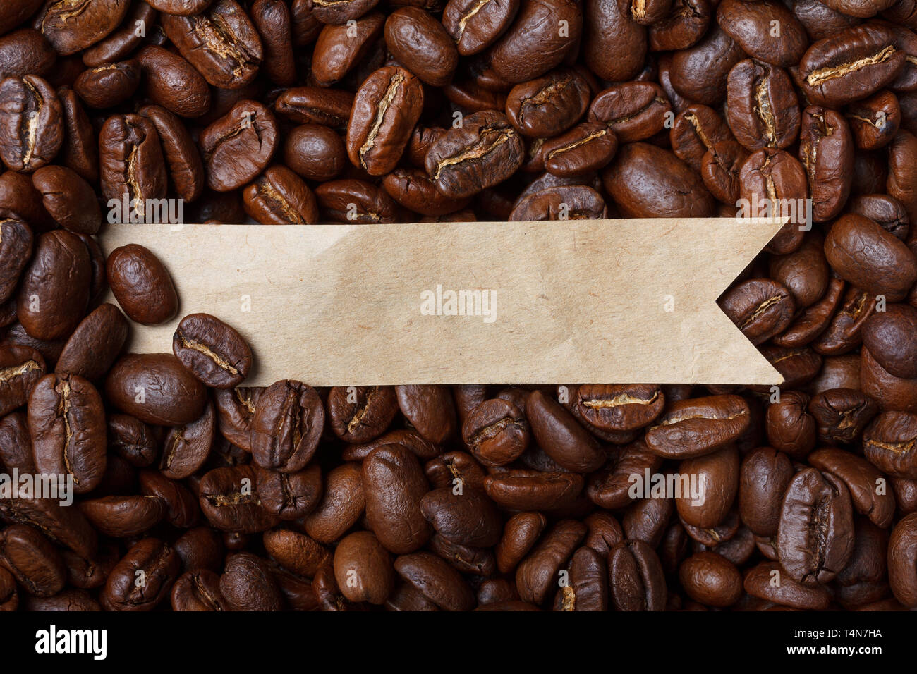 Roasted coffee with paper label tag Stock Photo - Alamy