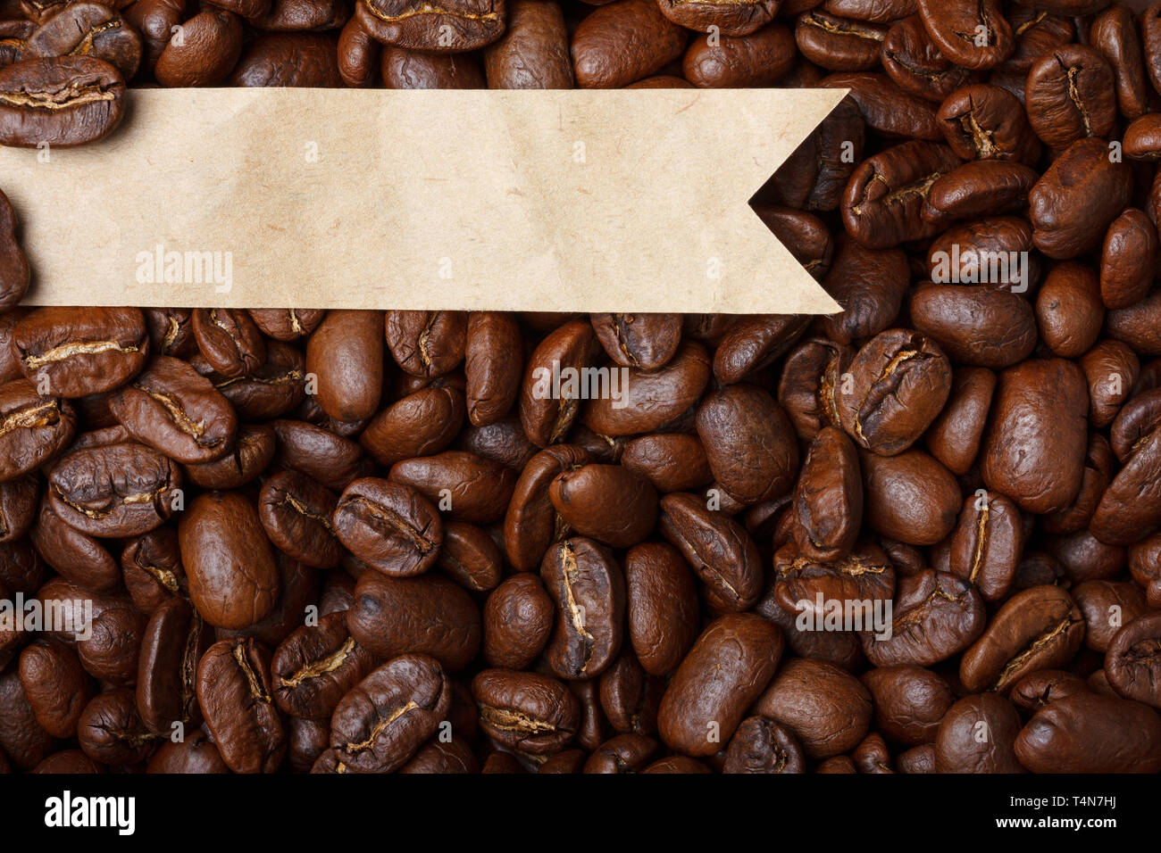 Roasted coffee with paper label tag Stock Photo - Alamy