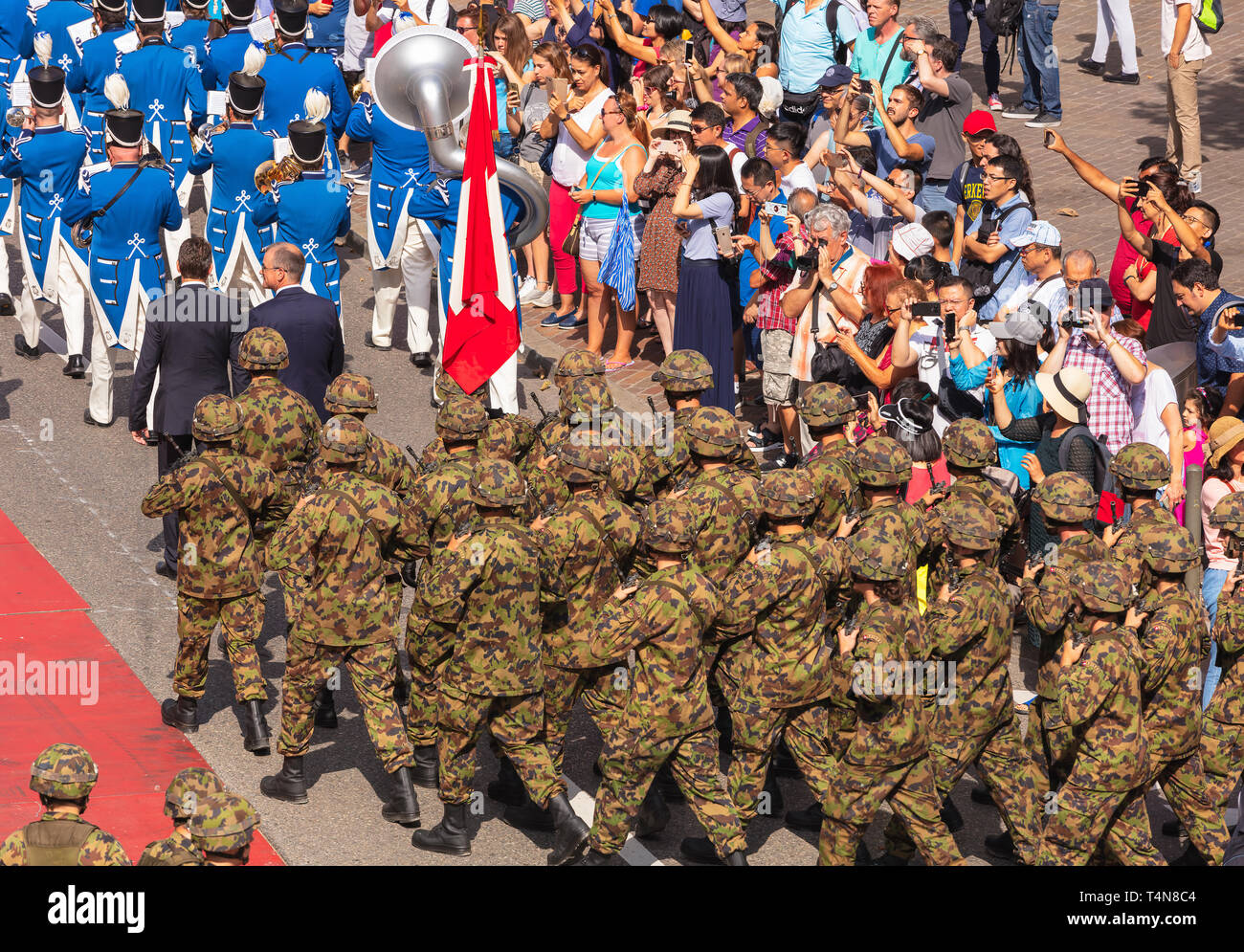 Participants of the parade devoted to the Swiss National Day passing ...
