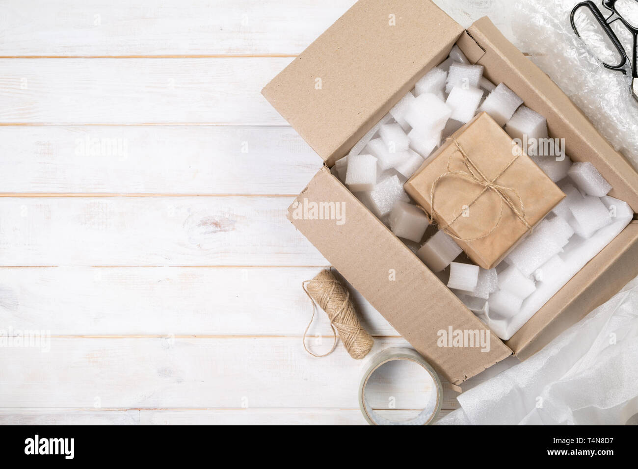 Packing products for delivery, shipping service Stock Photo - Alamy