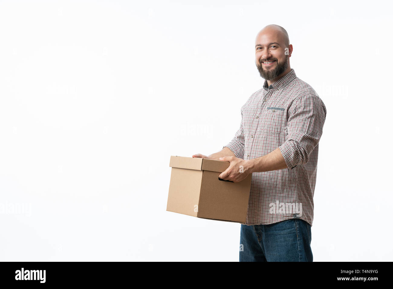 Portrait of a handsome young man holding card boxes, isolated on white ...
