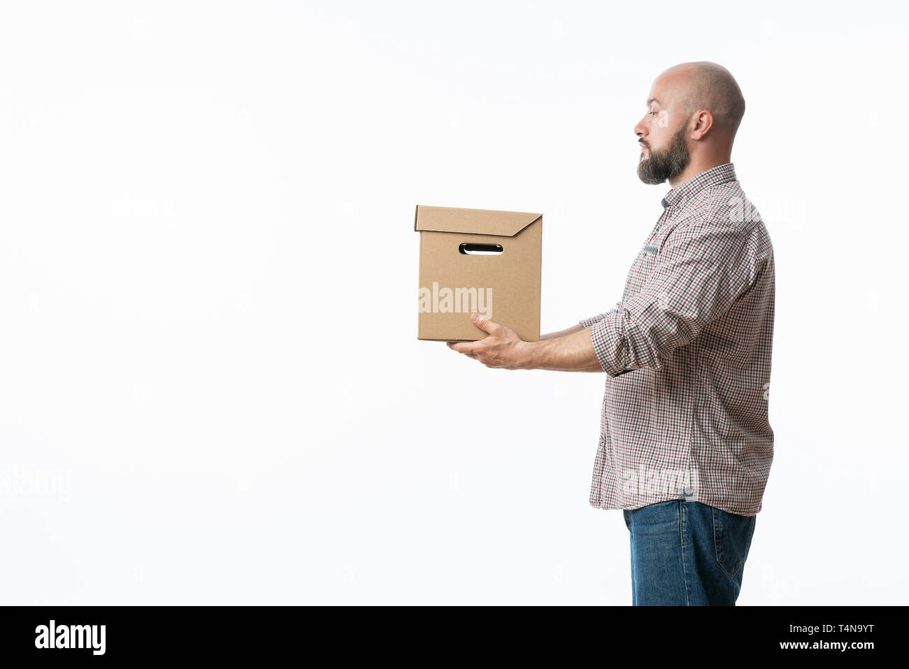 Portrait of a handsome young man holding card boxes, isolated on white ...