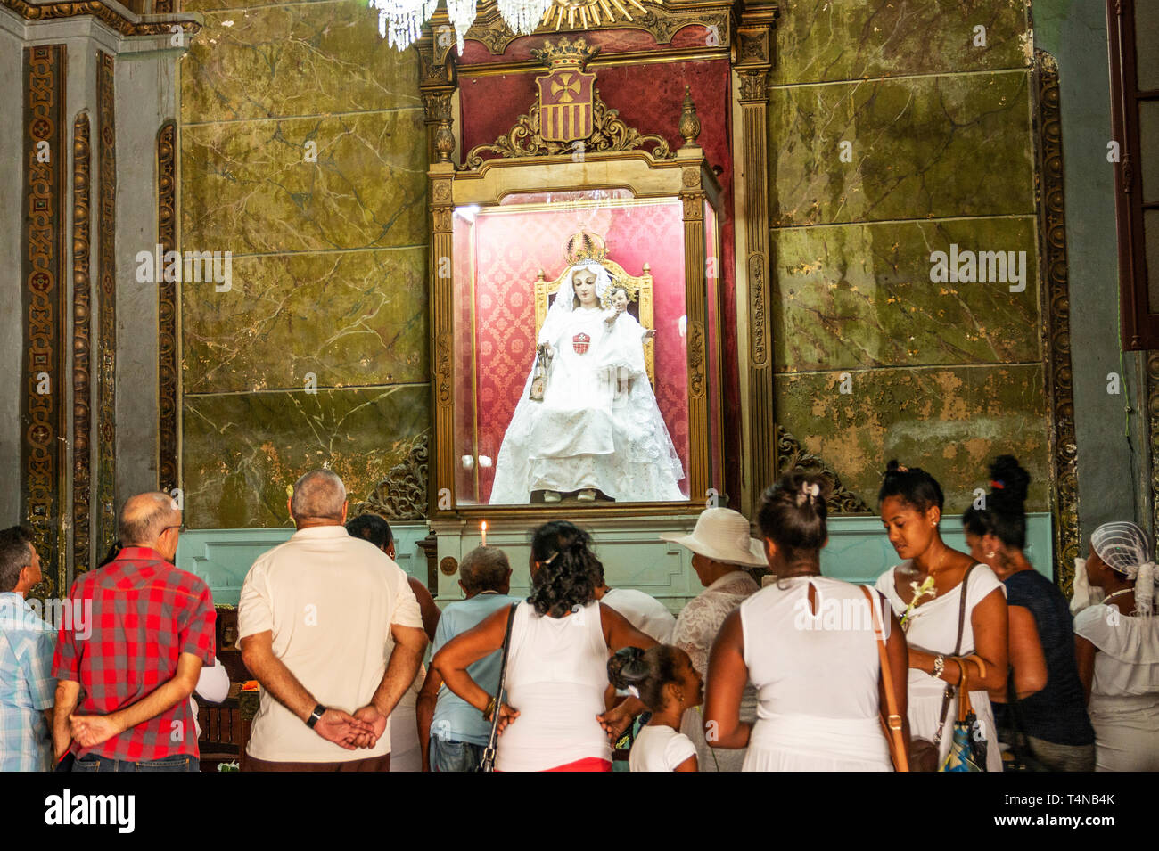 Havana, Cuba - 25 July 2018: People praying, lighting candles and ...