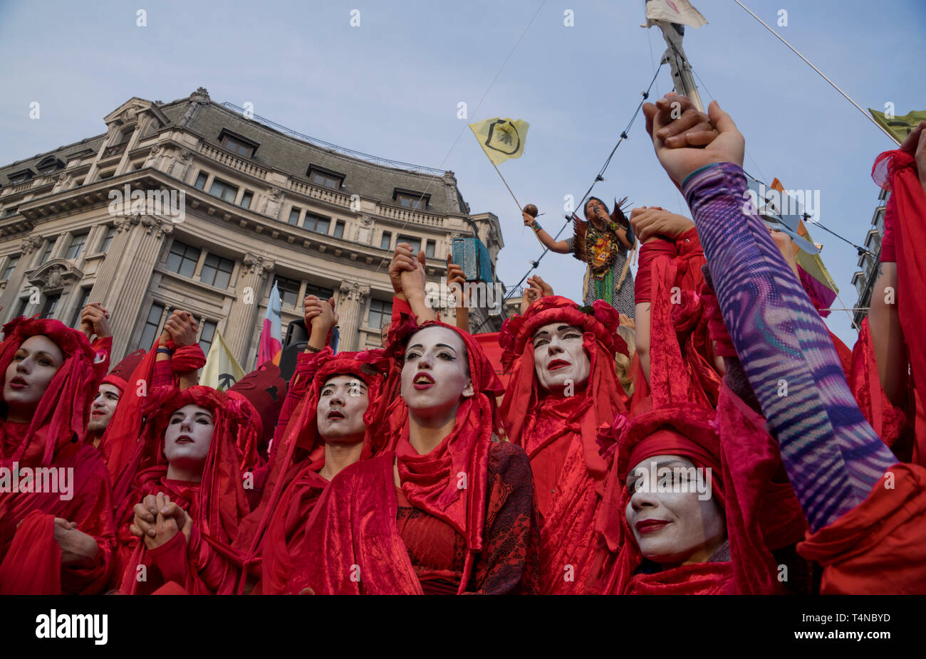 Extinction Rebellion activists block busy Oxford Circus and play music ...