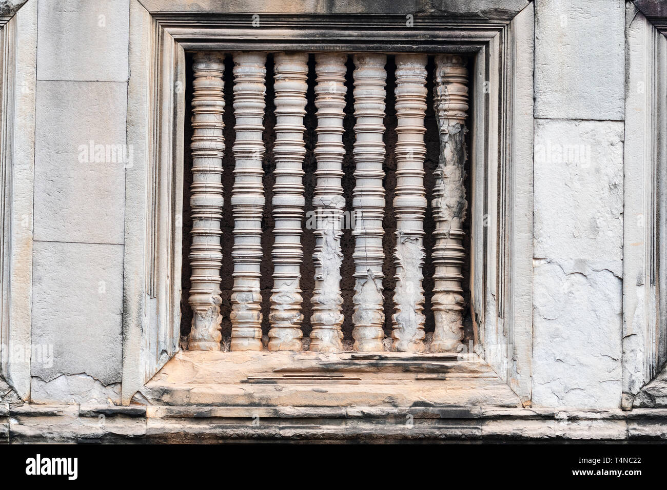 Traditional stone window slats at an ancient temple in Angkor Wat lcose ...