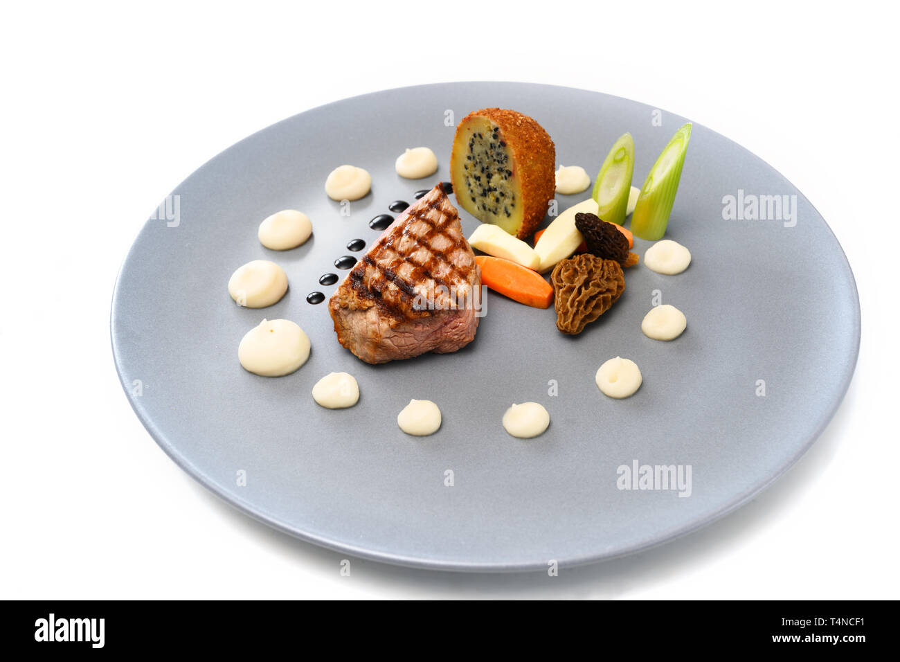 roasted veal, morels, vegetables and a fried potato stuffed with onion ...