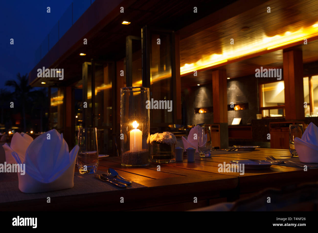 Restaurant tables outdoor table setting at evening Stock Photo - Alamy