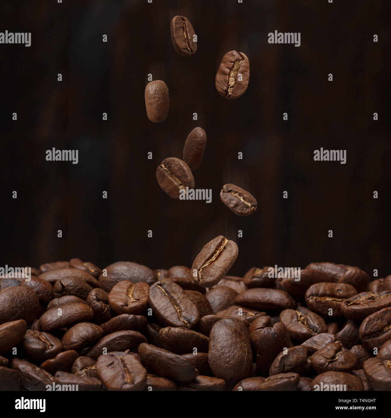 Coffee beans falling down Stock Photo - Alamy