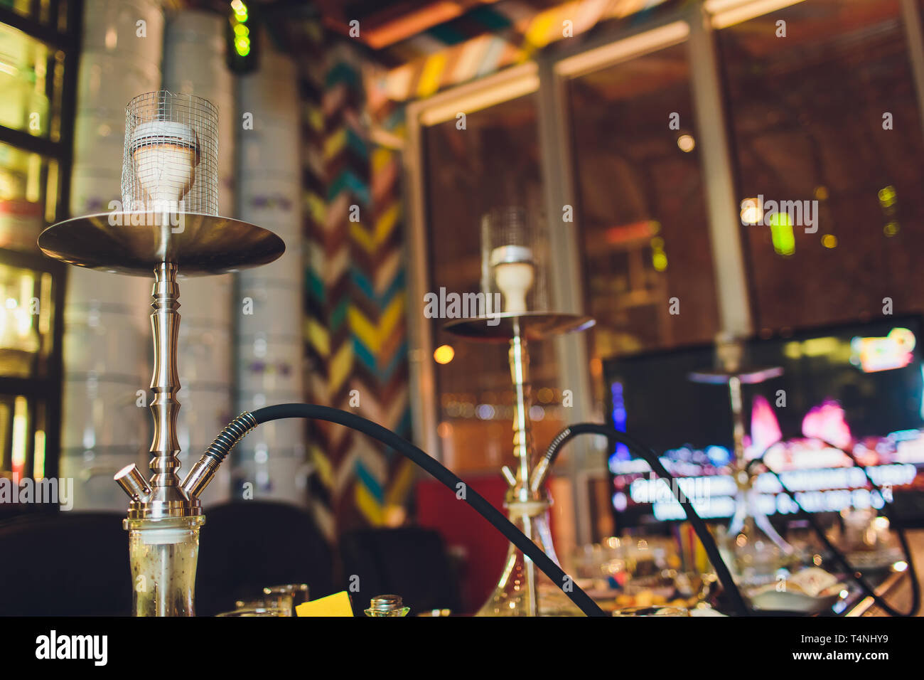 group of red hookahs shisha on table in interior Stock Photo - Alamy