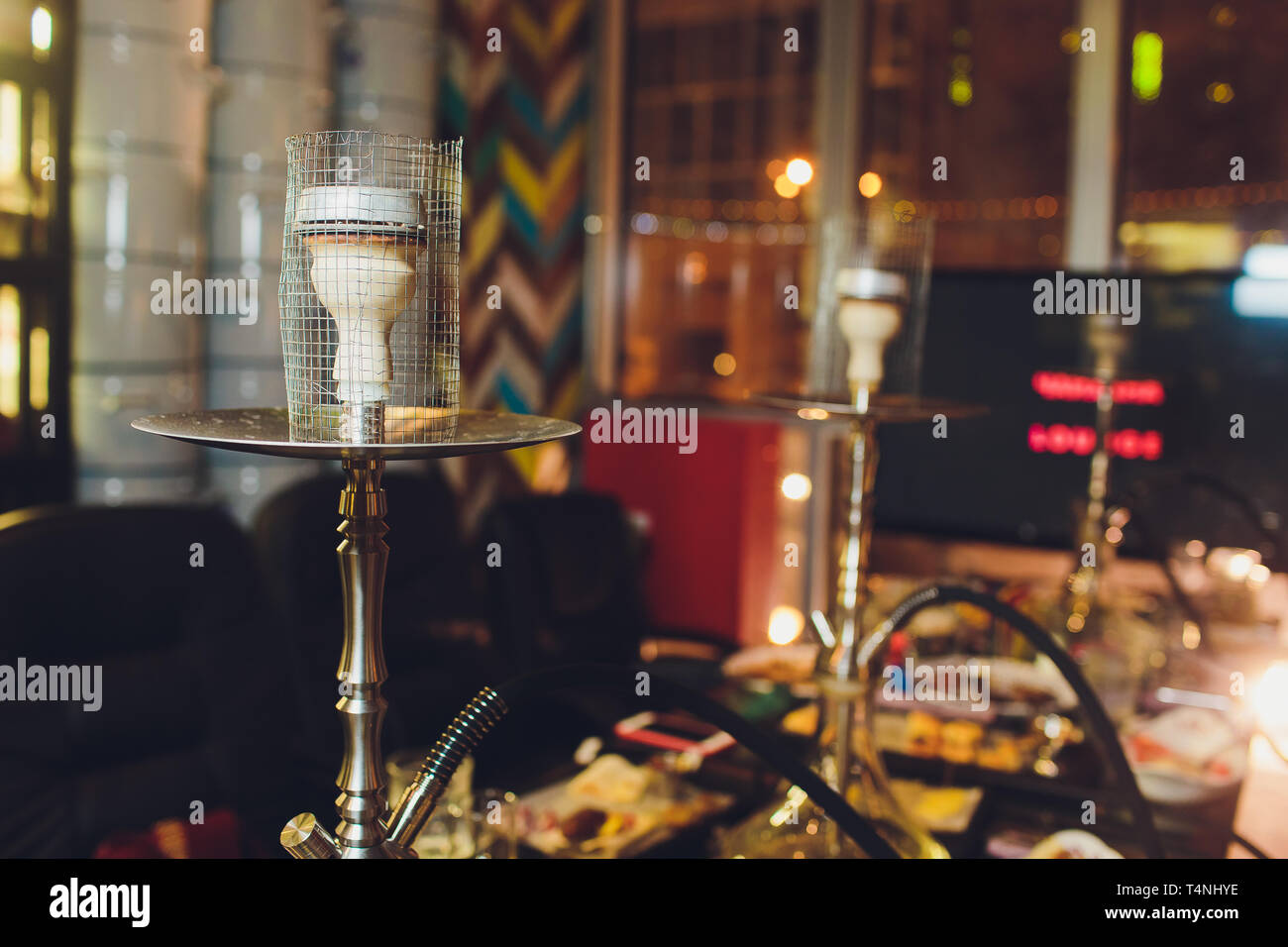 group of red hookahs shisha on table in interior Stock Photo - Alamy