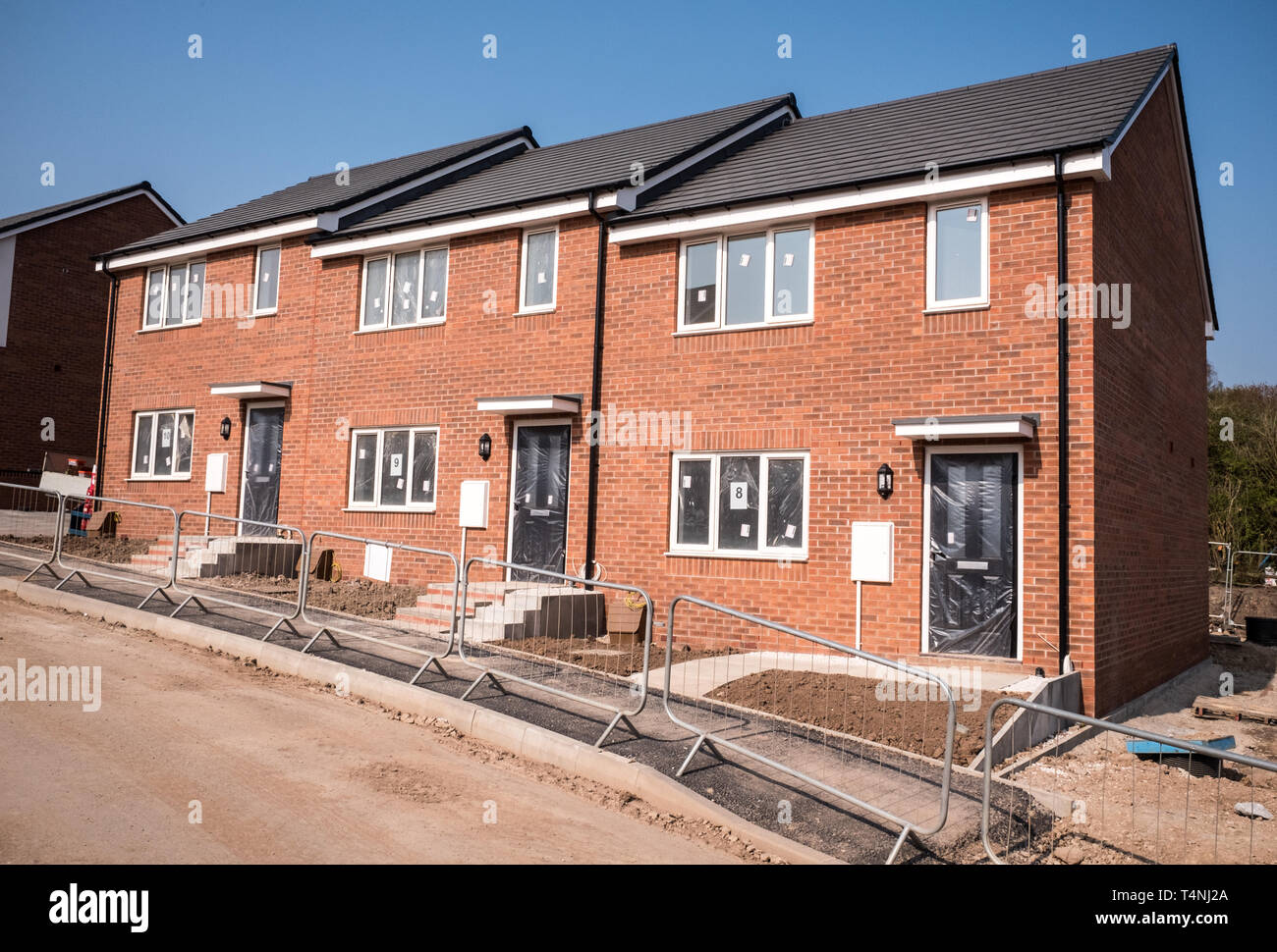 Brand new terraced brick houses on a building site Stock Photo - Alamy