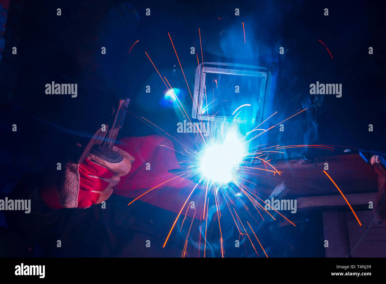 Welding with sparks Stock Photo - Alamy