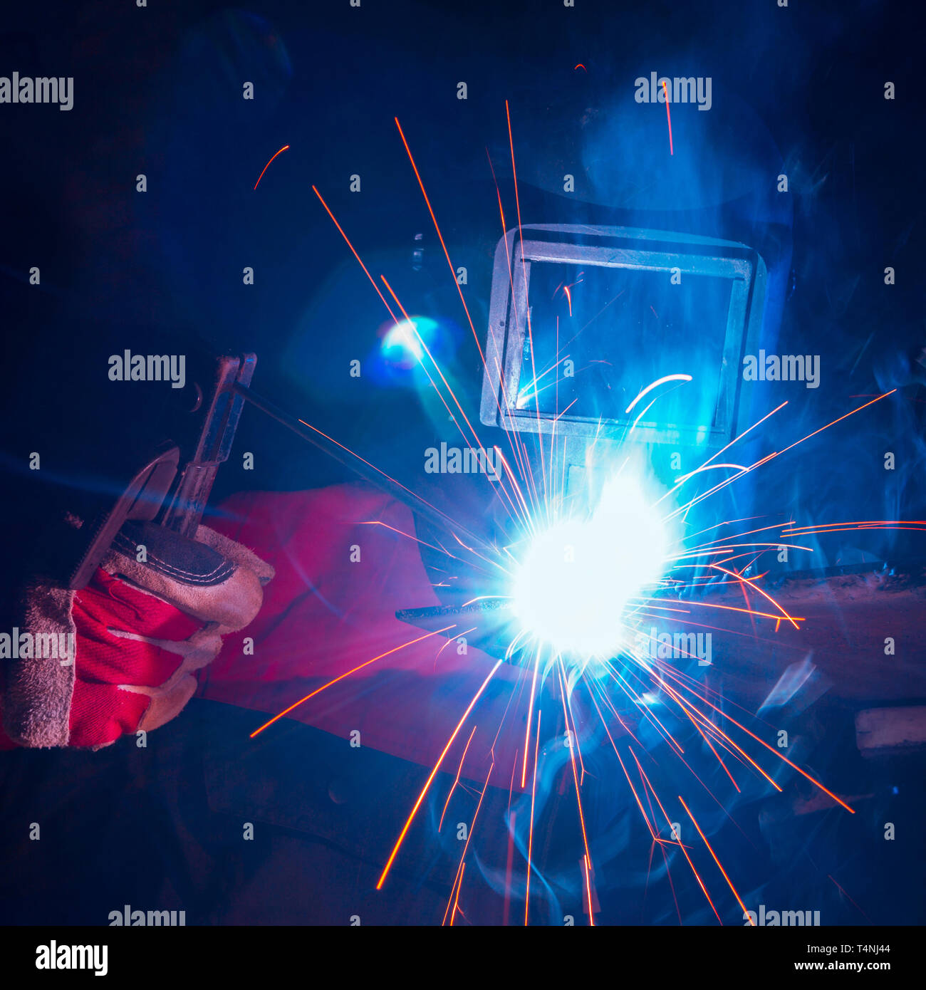 Welding metal with sparks Stock Photo - Alamy