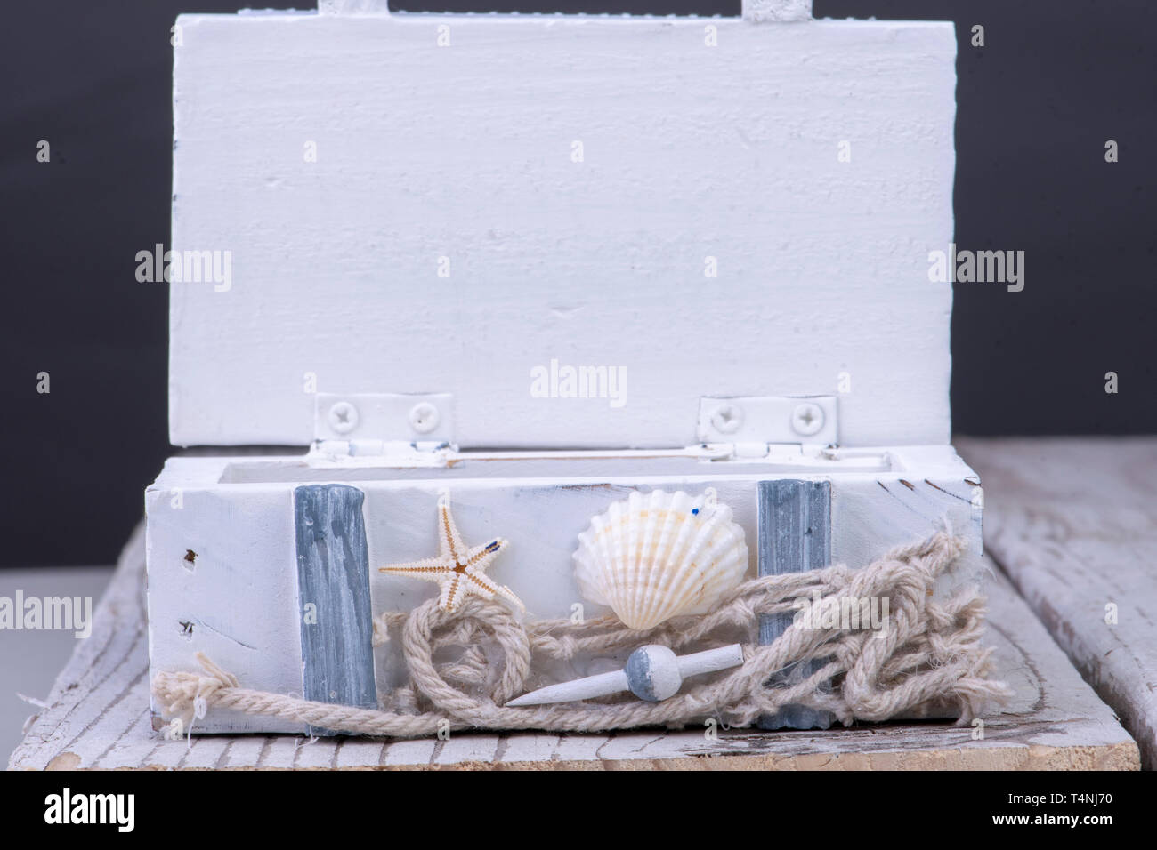 Wooden treasure chest with shells and ropes with open lid Stock Photo ...