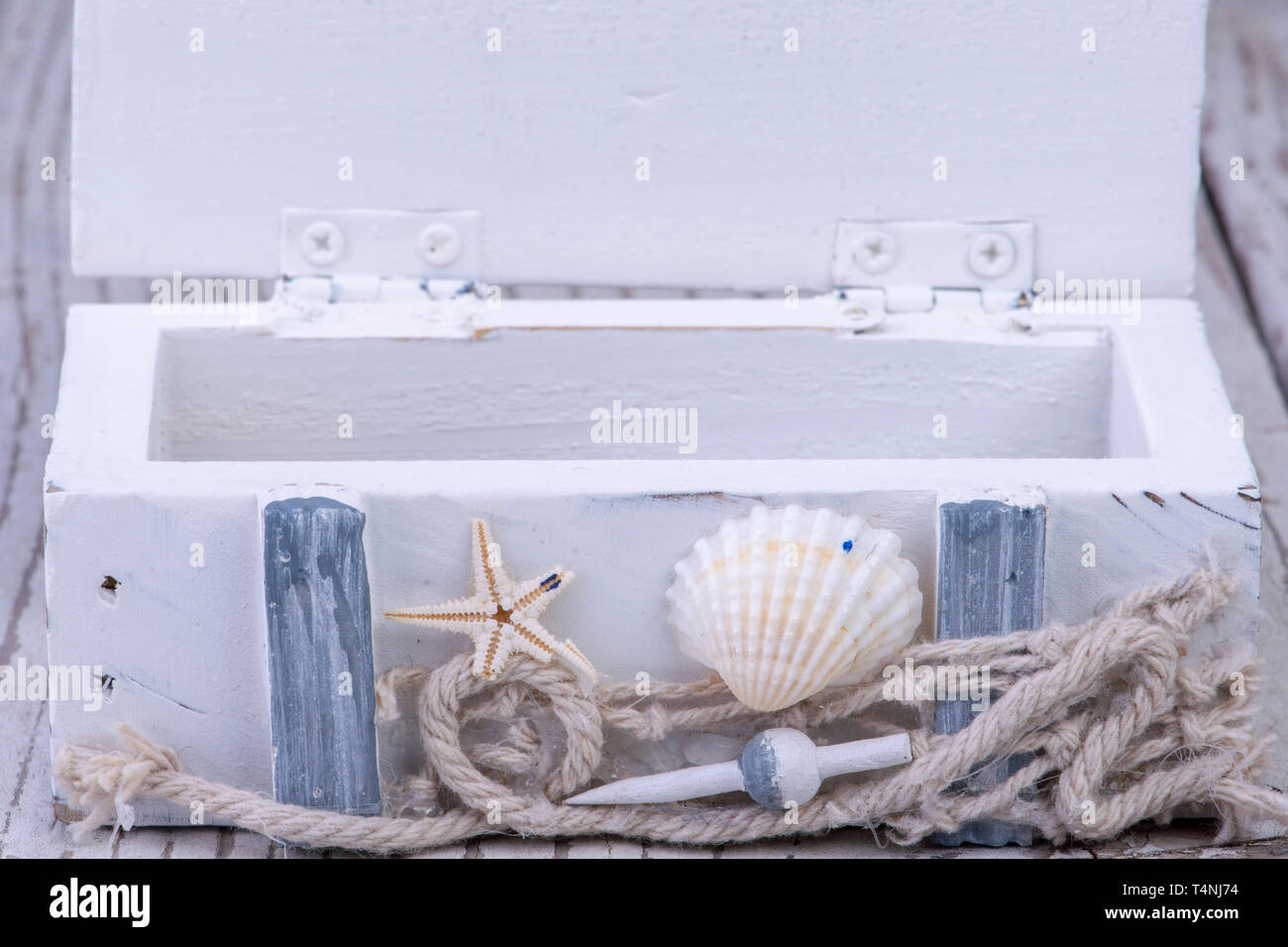 Wooden treasure chest with shells and ropes with open lid Stock Photo ...