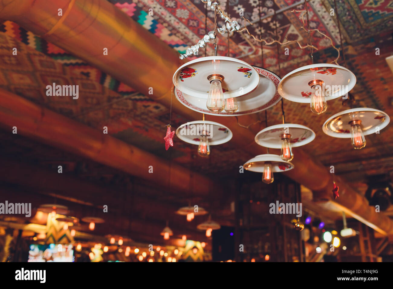 Ceiling and decorative chandeliers in restaurant interior Stock Photo ...