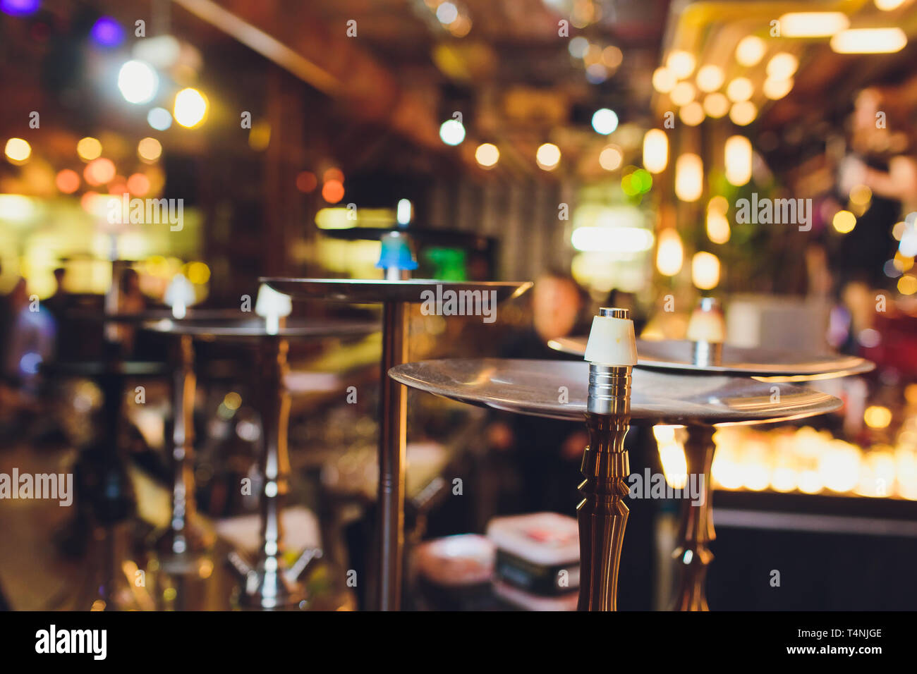 group of red hookahs shisha on table in interior Stock Photo - Alamy