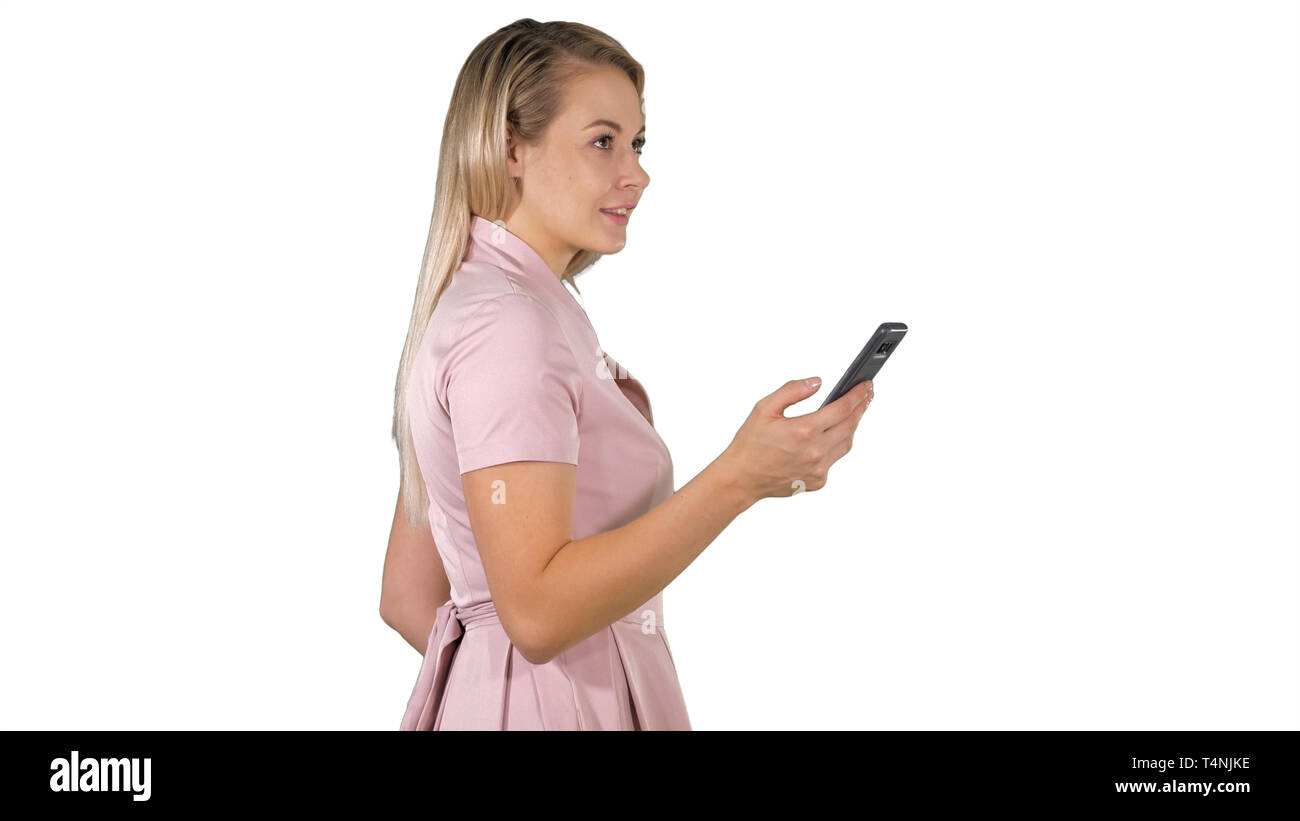 Medium shot side view. Happy woman selecting on line content in a smart ...