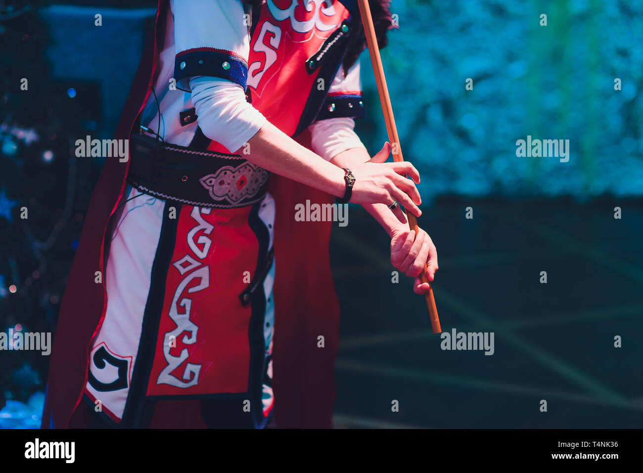 Man in national costume play national music instrument. kurai Stock ...