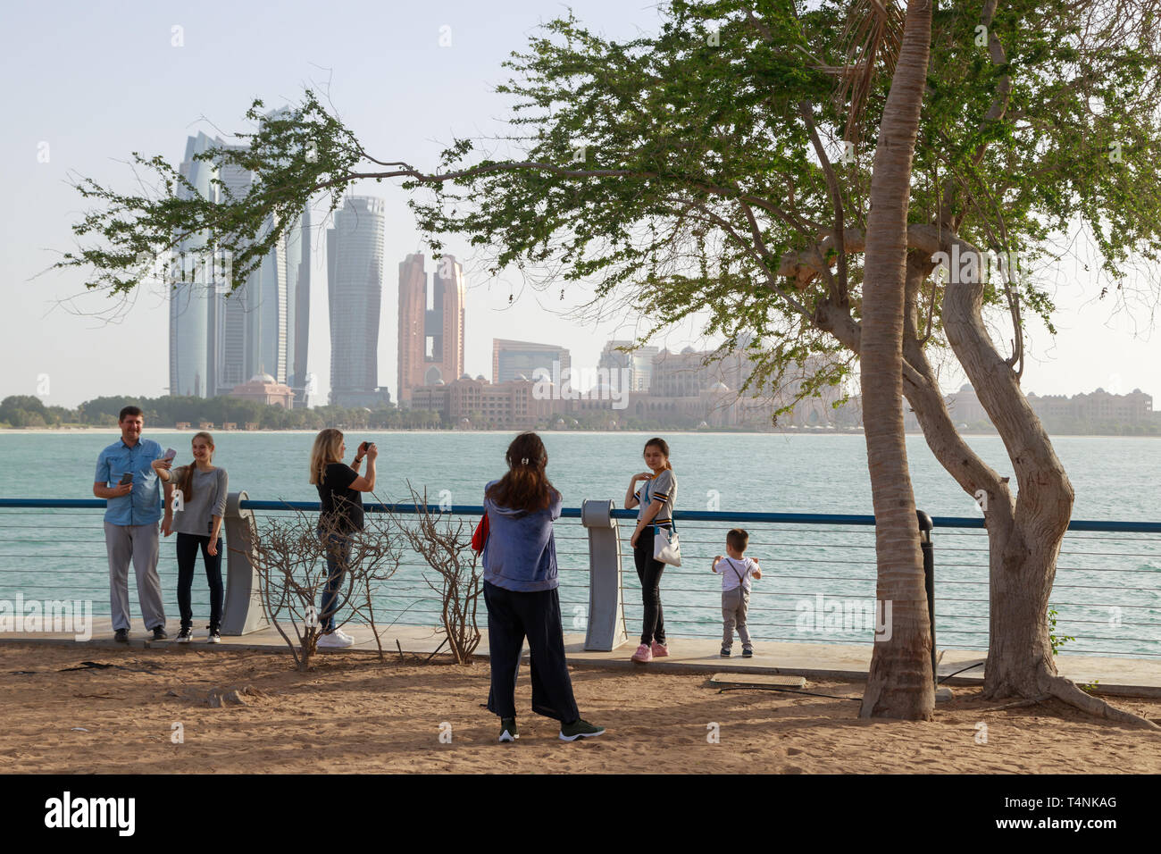 ABU DHABI, UAE, JANUARY 10, 2019: Tourists are photographed against the ...