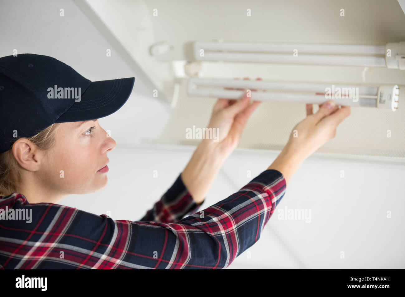 woman changing light bulb Stock Photo - Alamy