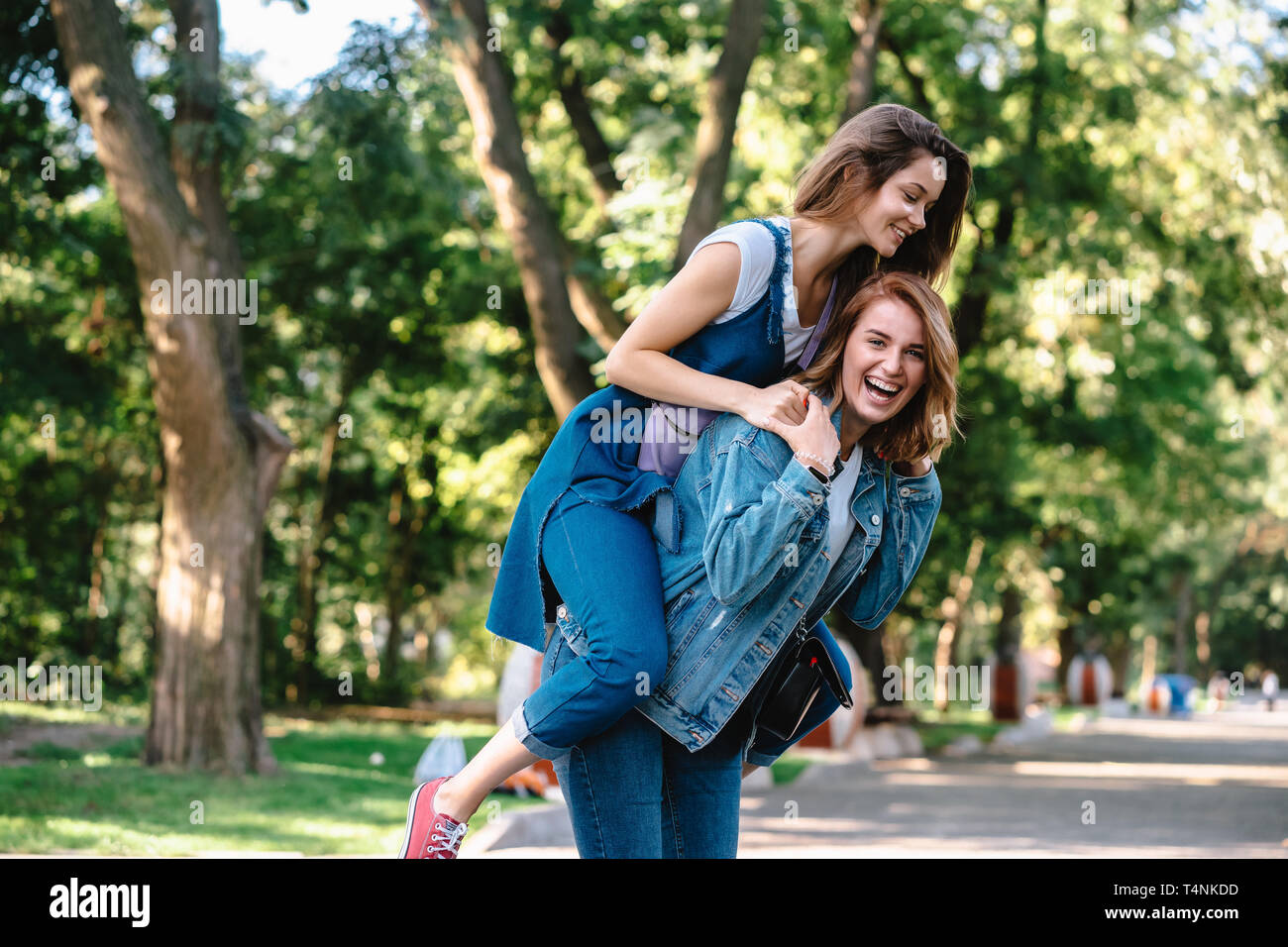 Beautiful Women Having Fun In The Park Friends And Summer Concept