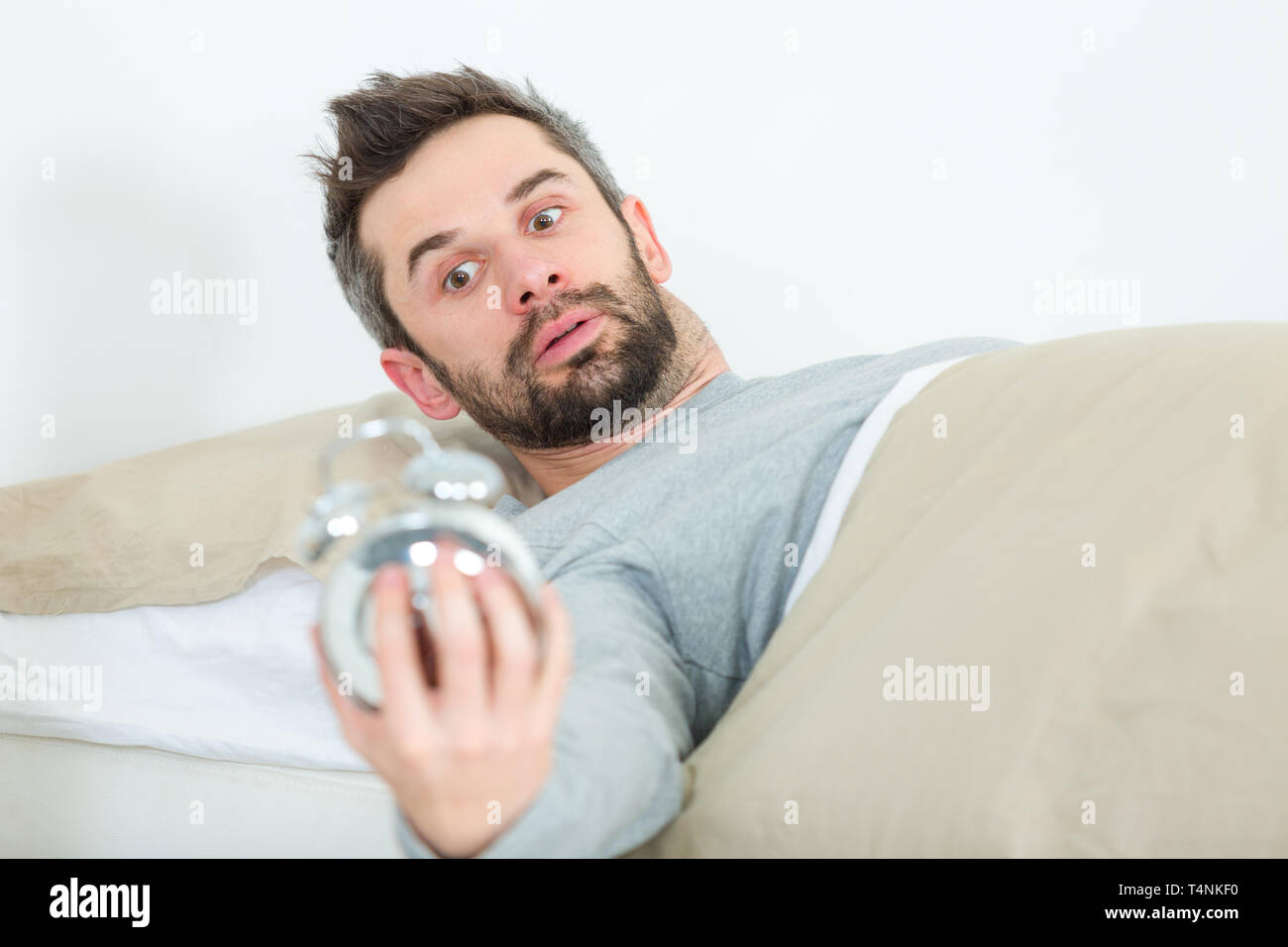 worried man running out of time in the morning Stock Photo - Alamy