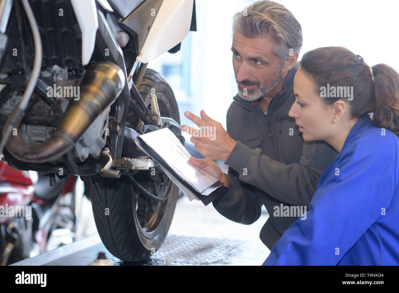 Mechanic servicing scooter hi-res stock photography and images - Alamy