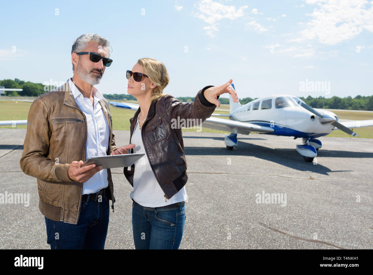 woman pointing at something outside an aircraft Stock Photo - Alamy