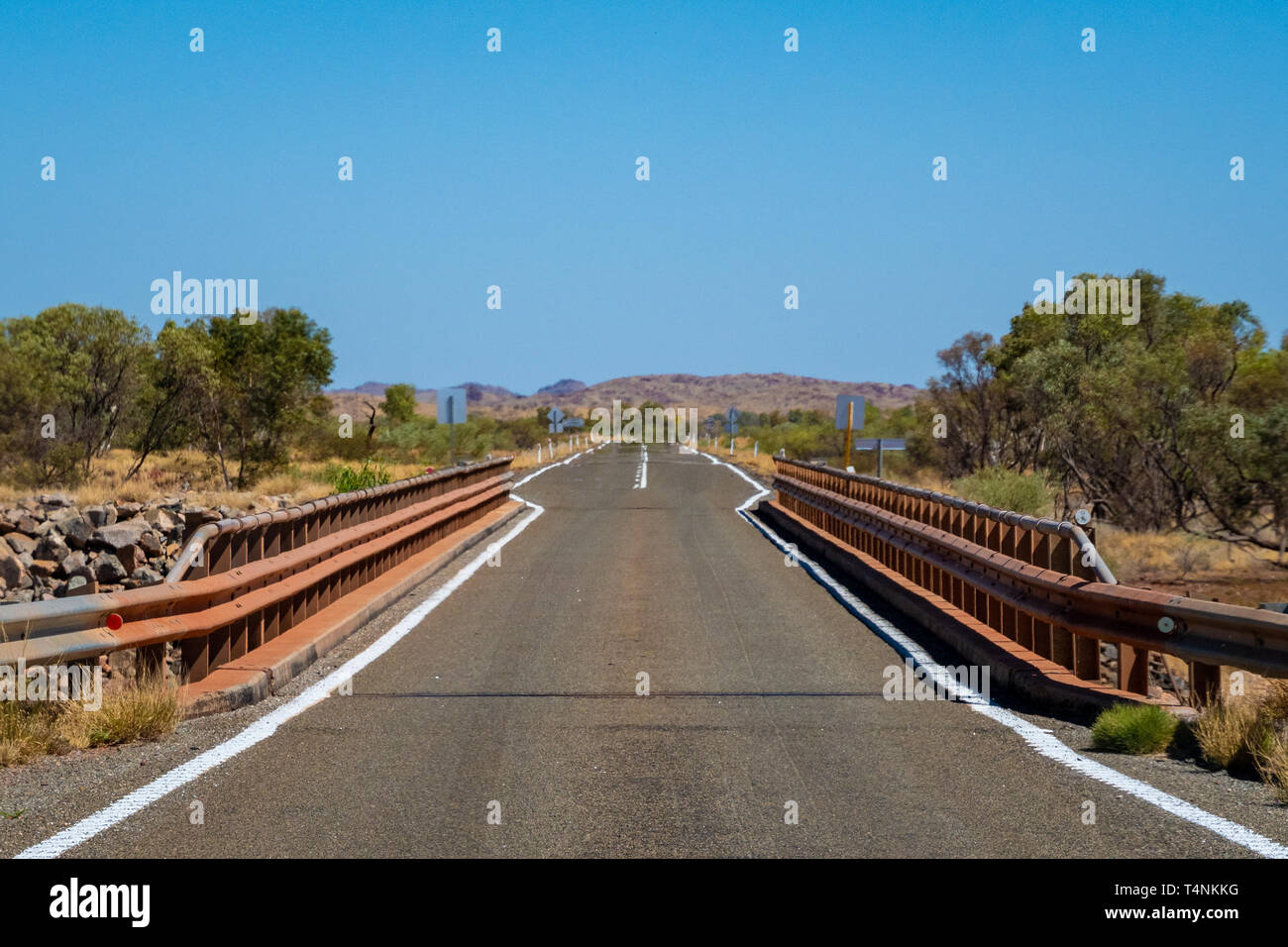 Single lane bridge interrupting two lane highway in Australian Outback ...