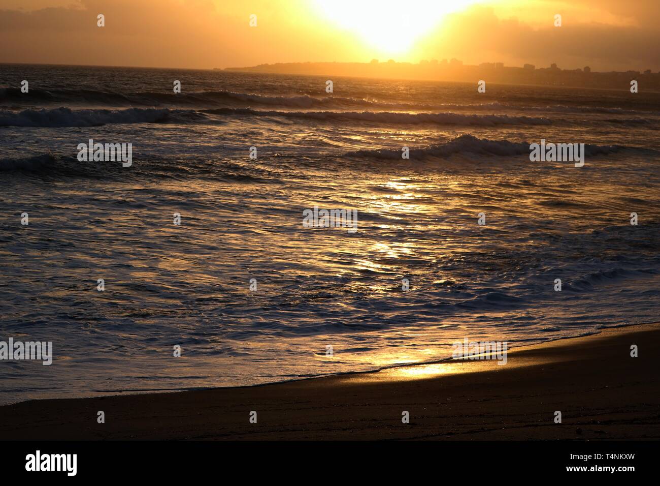 Sunset on the beach Stock Photo - Alamy