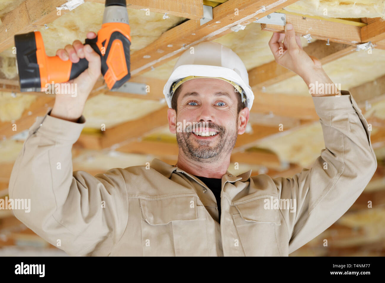 Young man drilling ceiling hi-res stock photography and images - Alamy