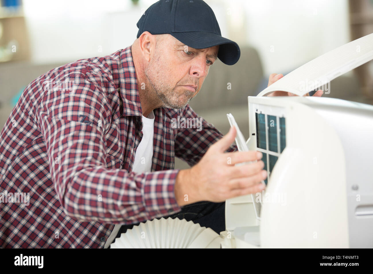 fixing and maintaining air conditioning system Stock Photo - Alamy