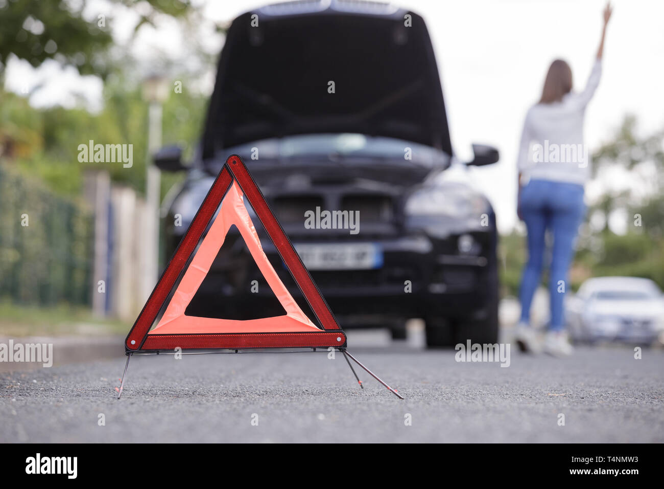 red triangle of a car on the road Stock Photo - Alamy