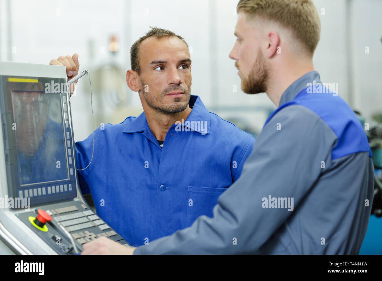 factory workers talking Stock Photo - Alamy