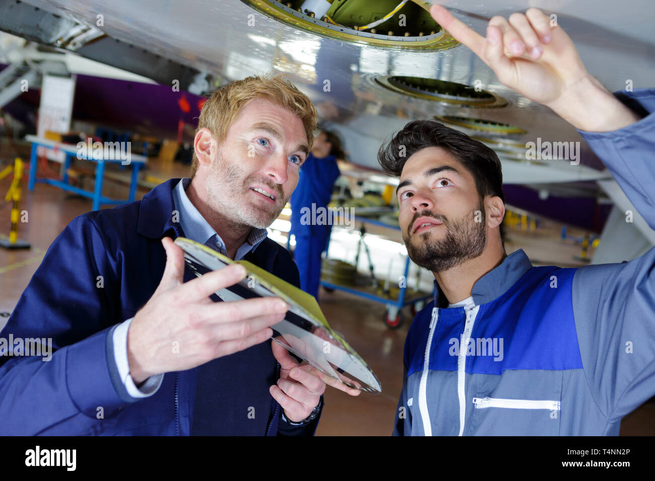 aviation assembling team at work Stock Photo - Alamy