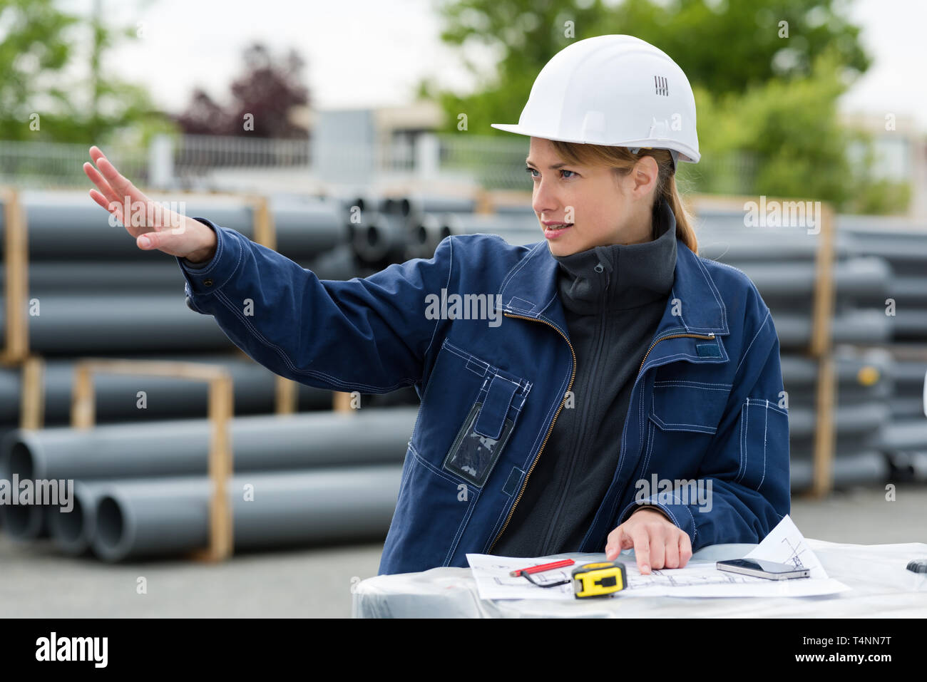young woman in a ventilation pipes factory Stock Photo - Alamy