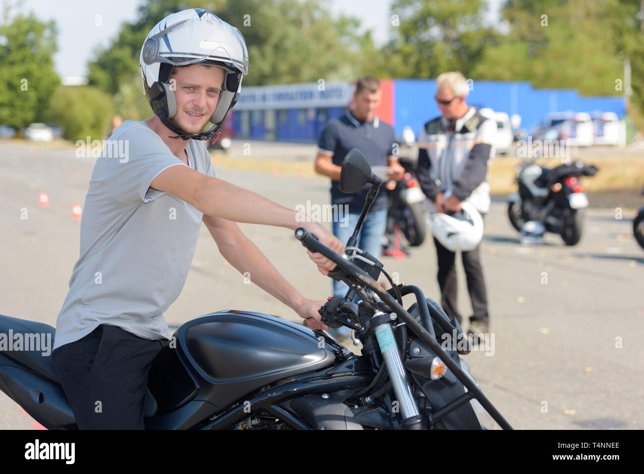 young man doing his motorbike test Stock Photo - Alamy