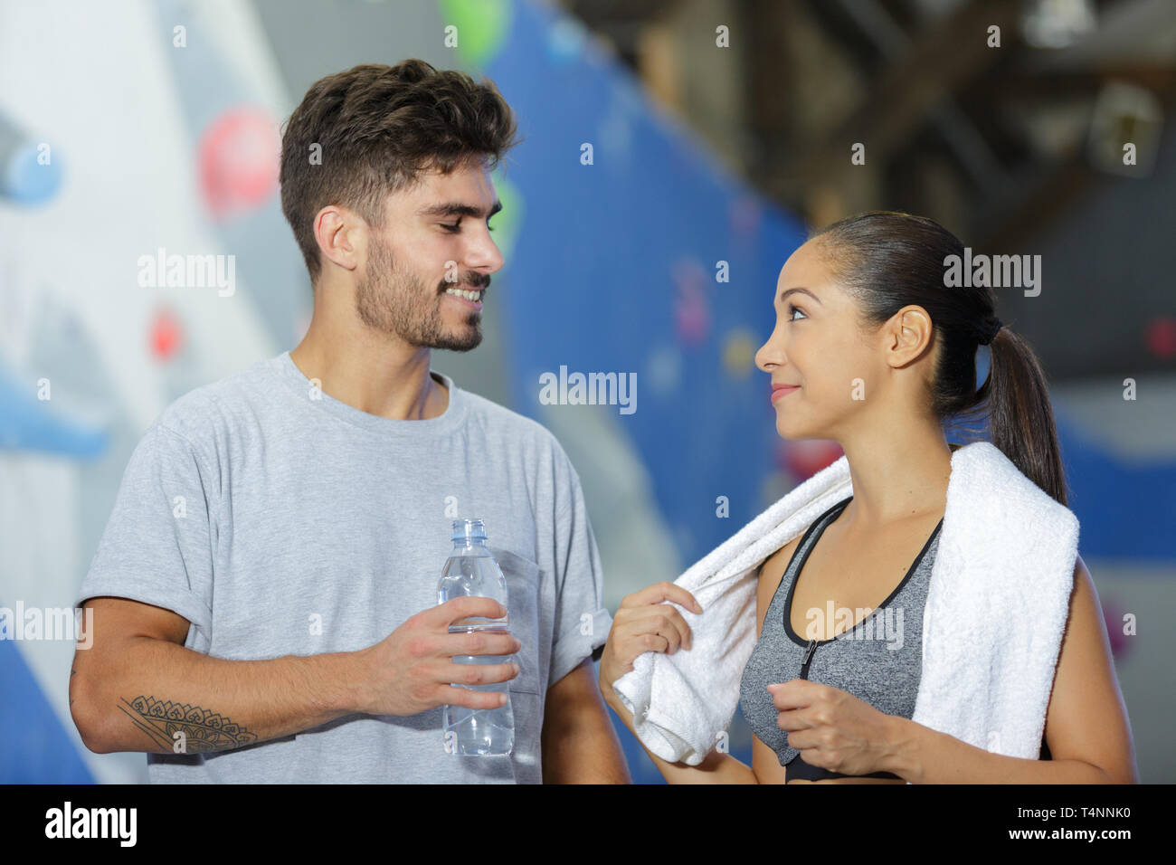 attractive young sports people are talking and smiling Stock Photo - Alamy
