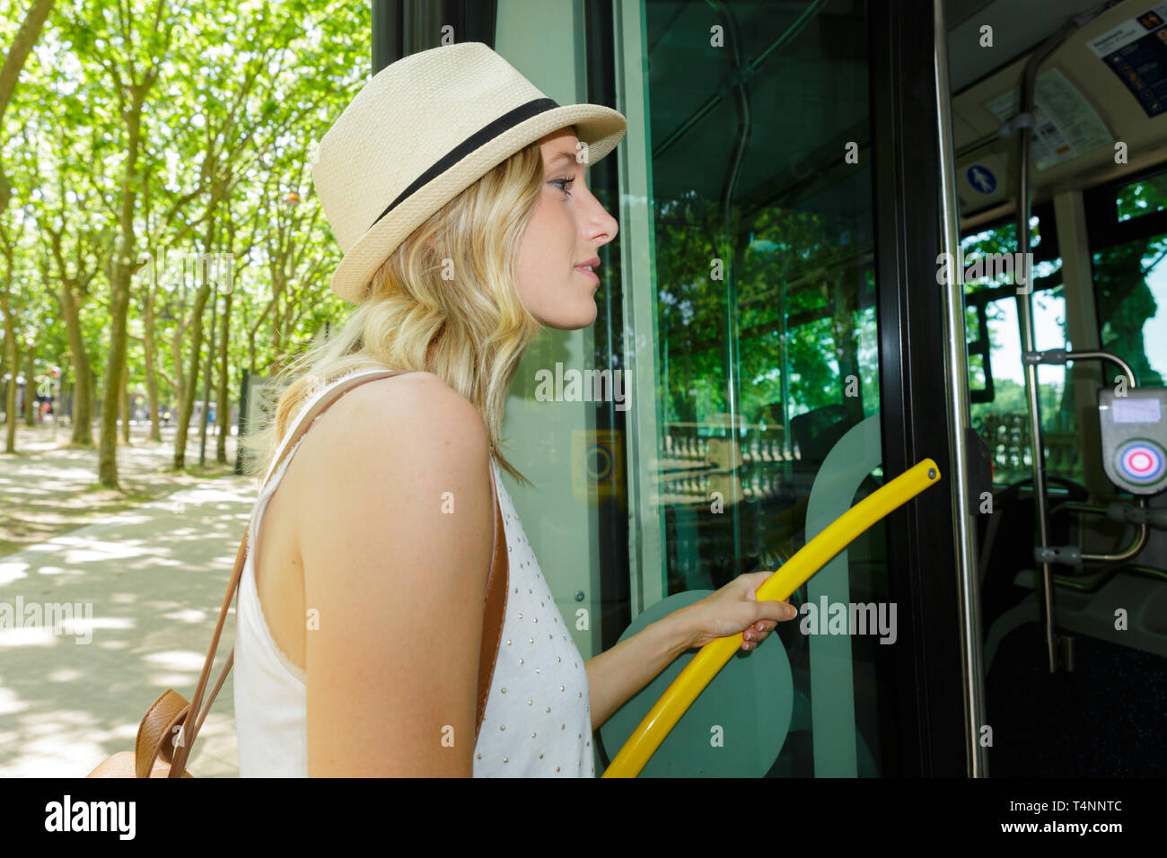 Woman boarding a bus hi-res stock photography and images - Alamy