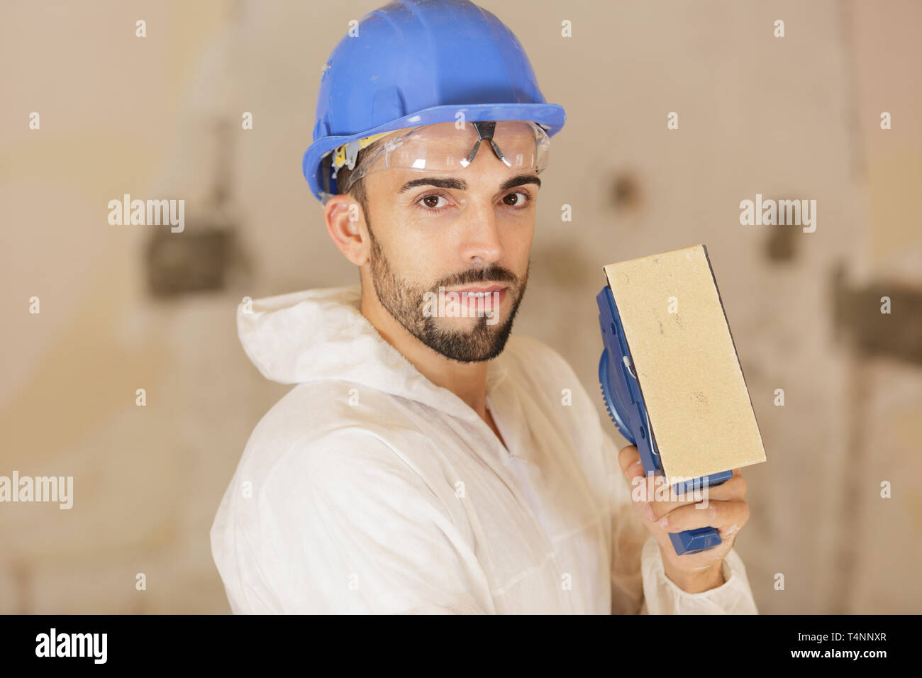 carpenter using sander machine sanding on pine wood surface Stock Photo ...