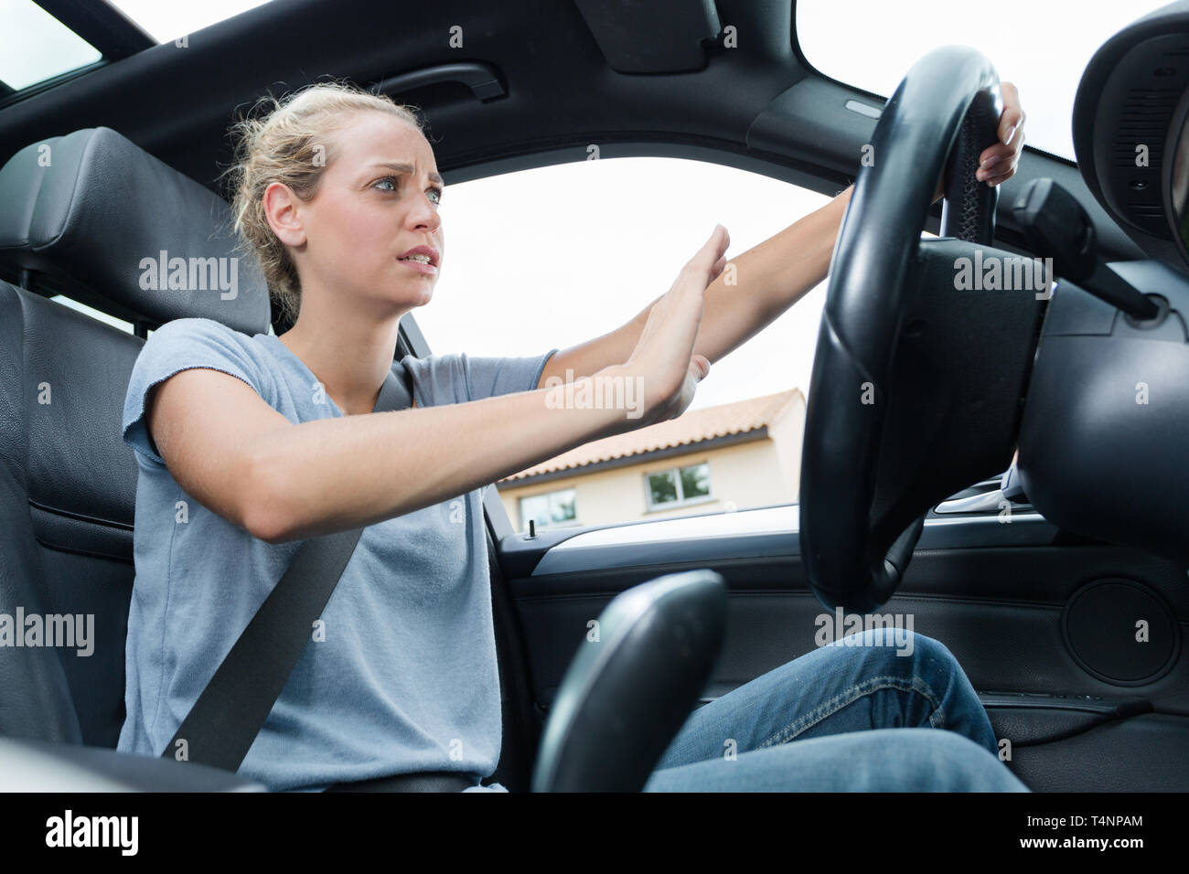 scared woman driving car in a panic Stock Photo - Alamy