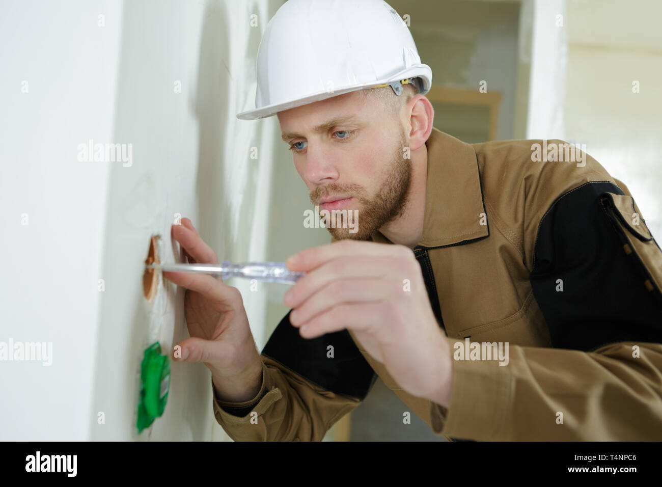 electrician fitting socket Stock Photo - Alamy