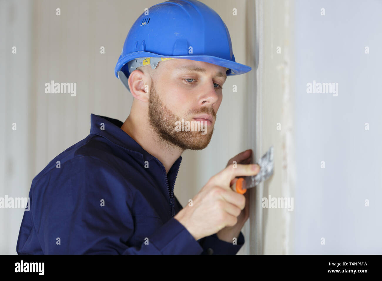young plasterer at work Stock Photo - Alamy