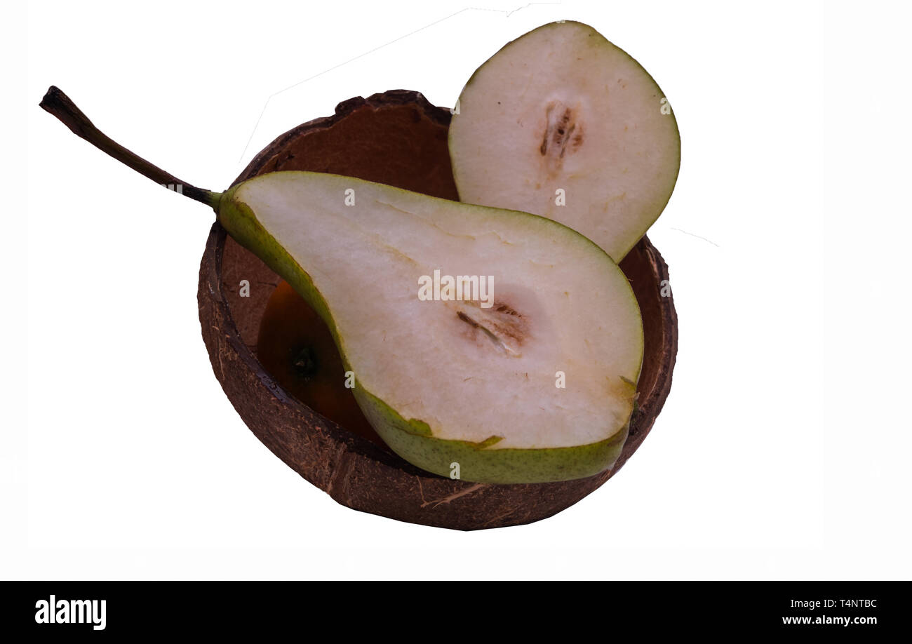 Fresh pear in coconut shell on white background Stock Photo - Alamy